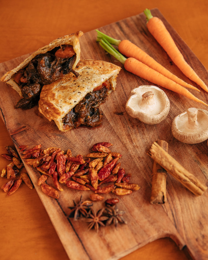 Roti Bros | Pies made with a flaky roti pastry.